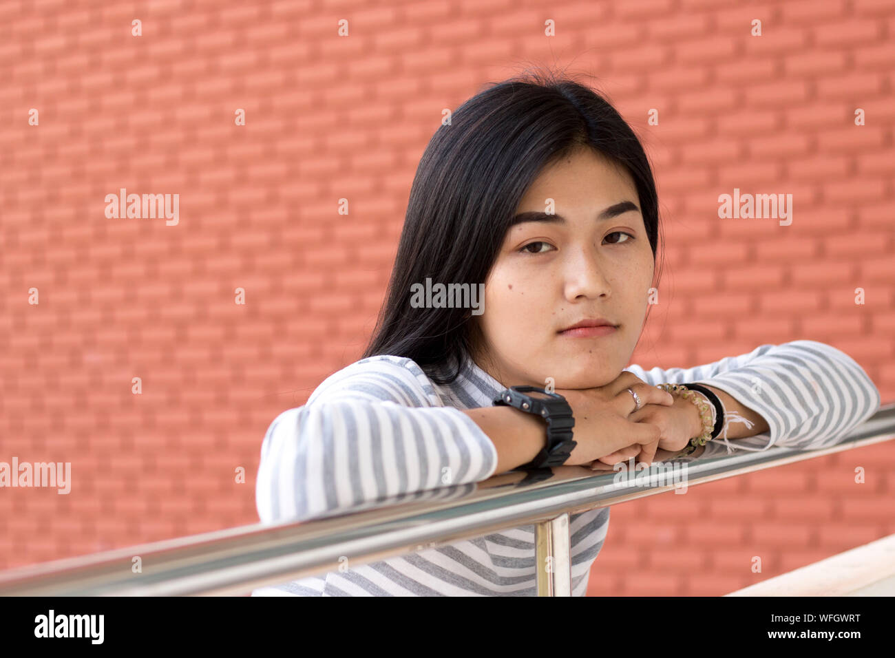 Person leaning against brick wall hi-res stock photography and images ...