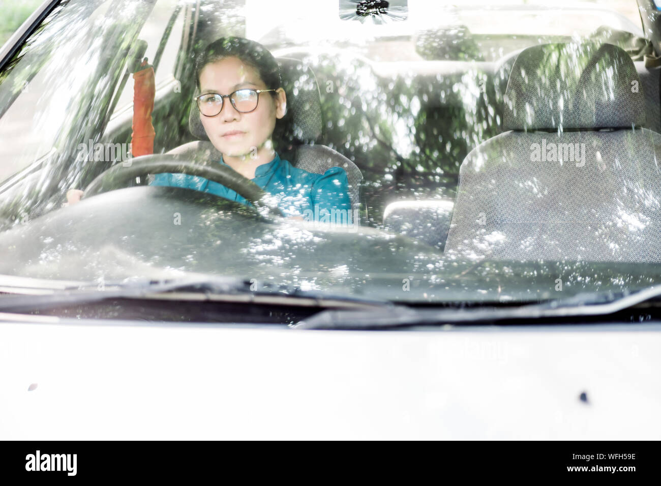Asian woman driving car hi-res stock photography and images - Alamy