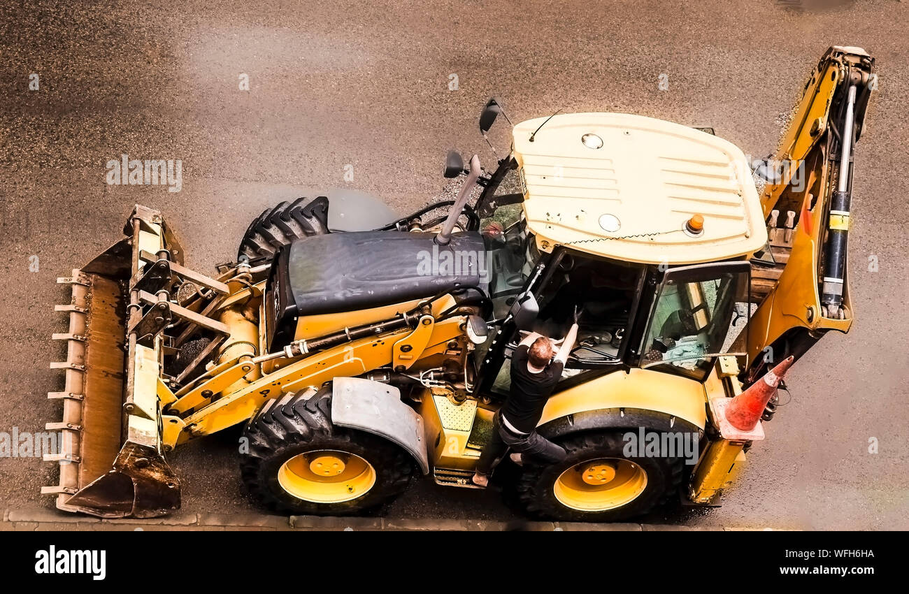 Excavation machine for digging soil and asphalt Stock Photo - Alamy