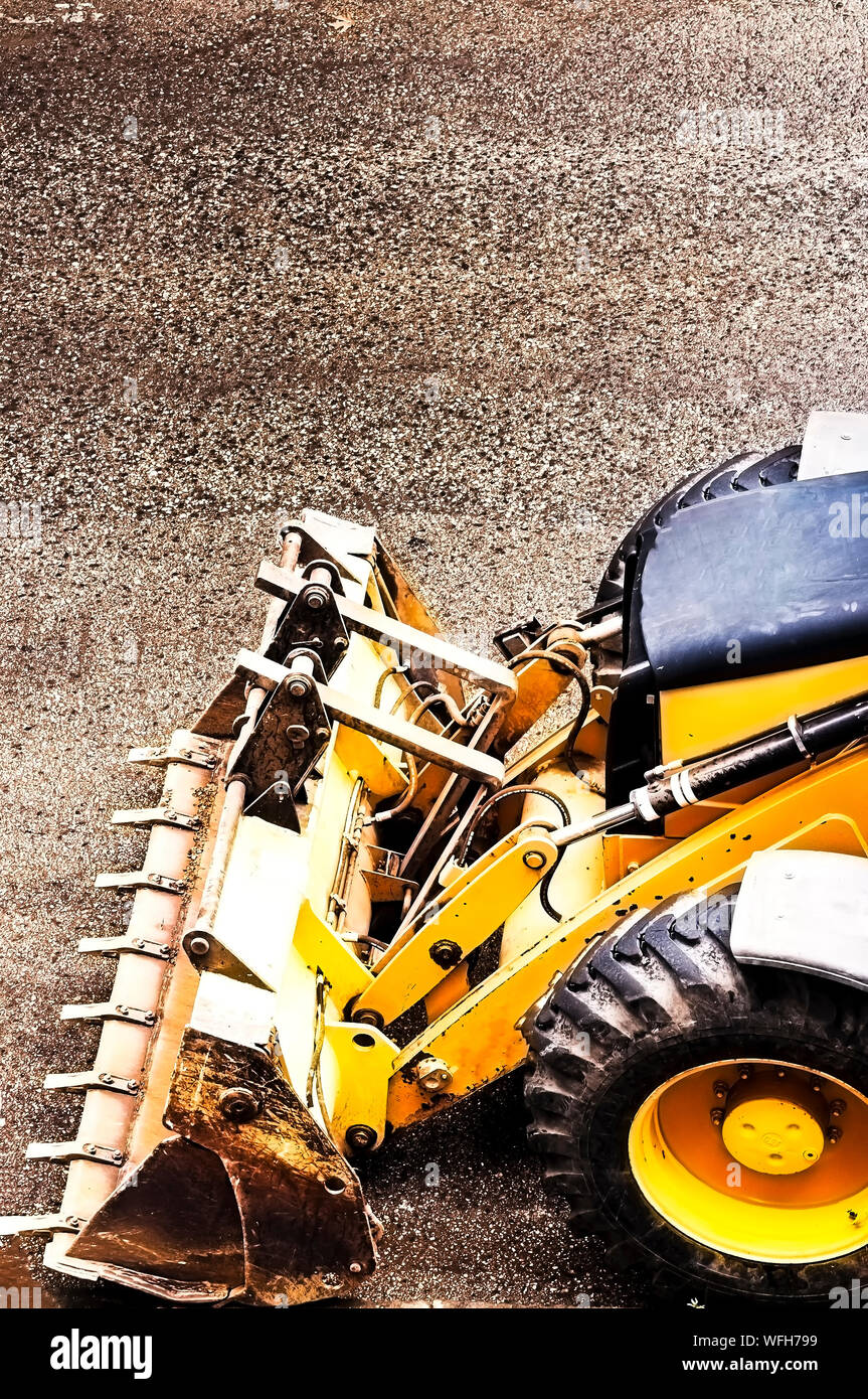 Excavation machine for digging soil and asphalt Stock Photo - Alamy