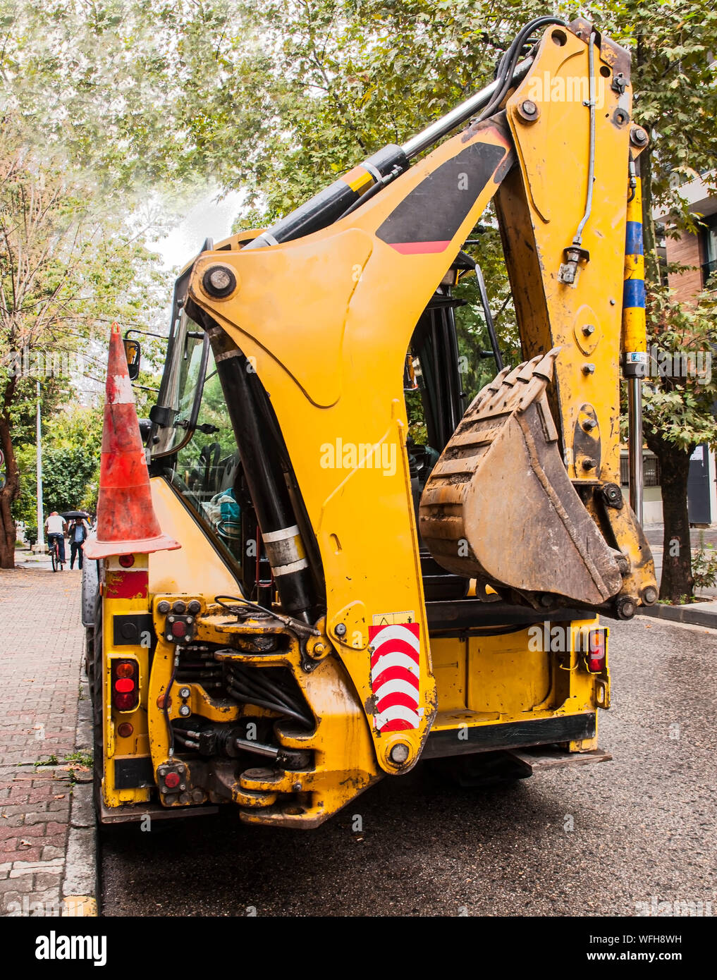 Excavation machine for digging soil and asphalt Stock Photo - Alamy