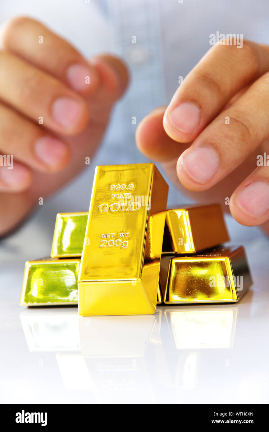 Gold Ingot Hand High Resolution Stock Photography and Images - Alamy