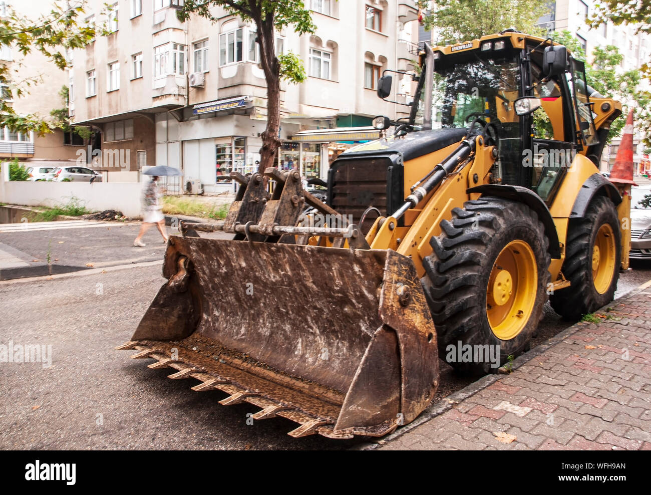 Excavation machine for digging soil and asphalt Stock Photo - Alamy