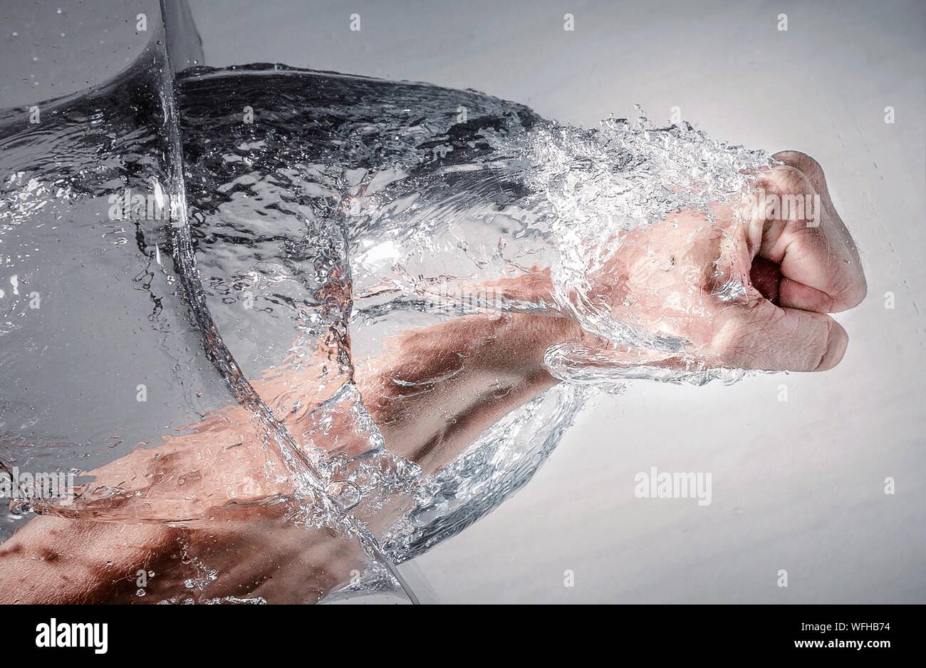 Fist punching water hi-res stock photography and images - Alamy