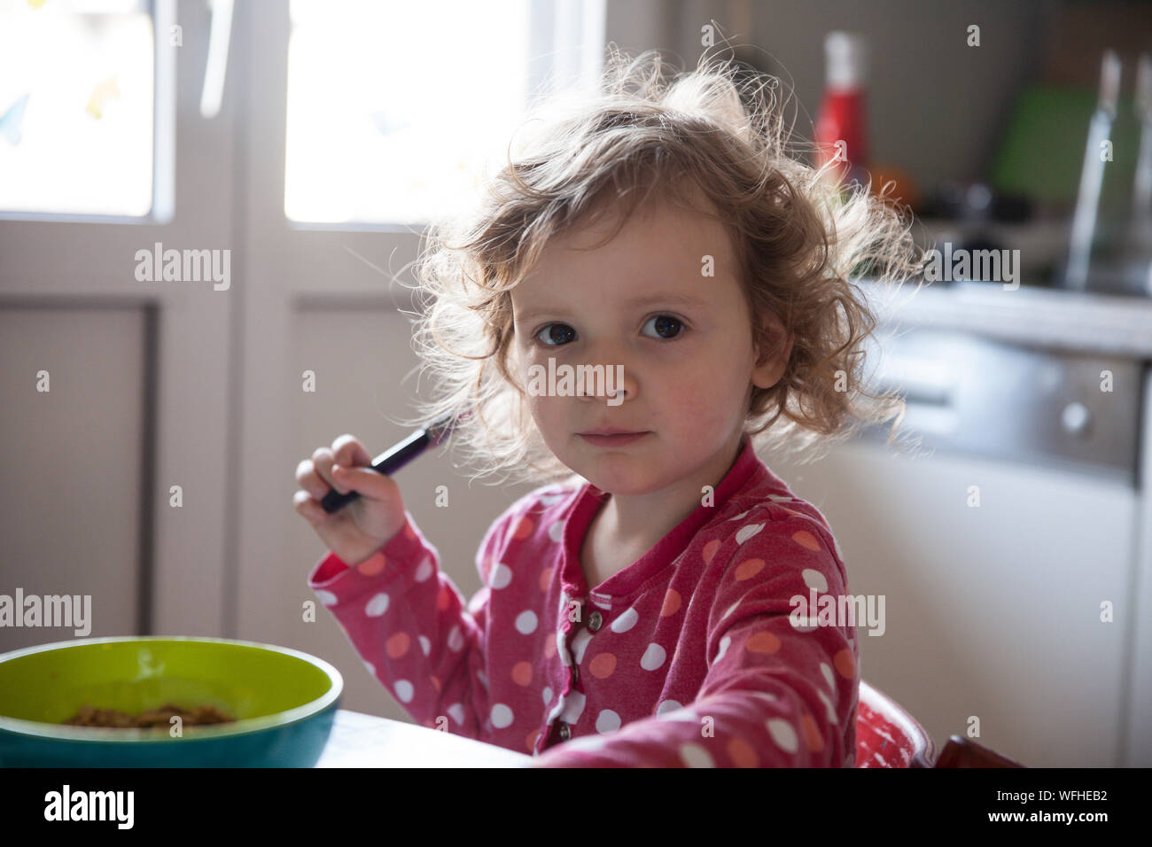 Girl sitting table hi-res stock photography and images - Alamy