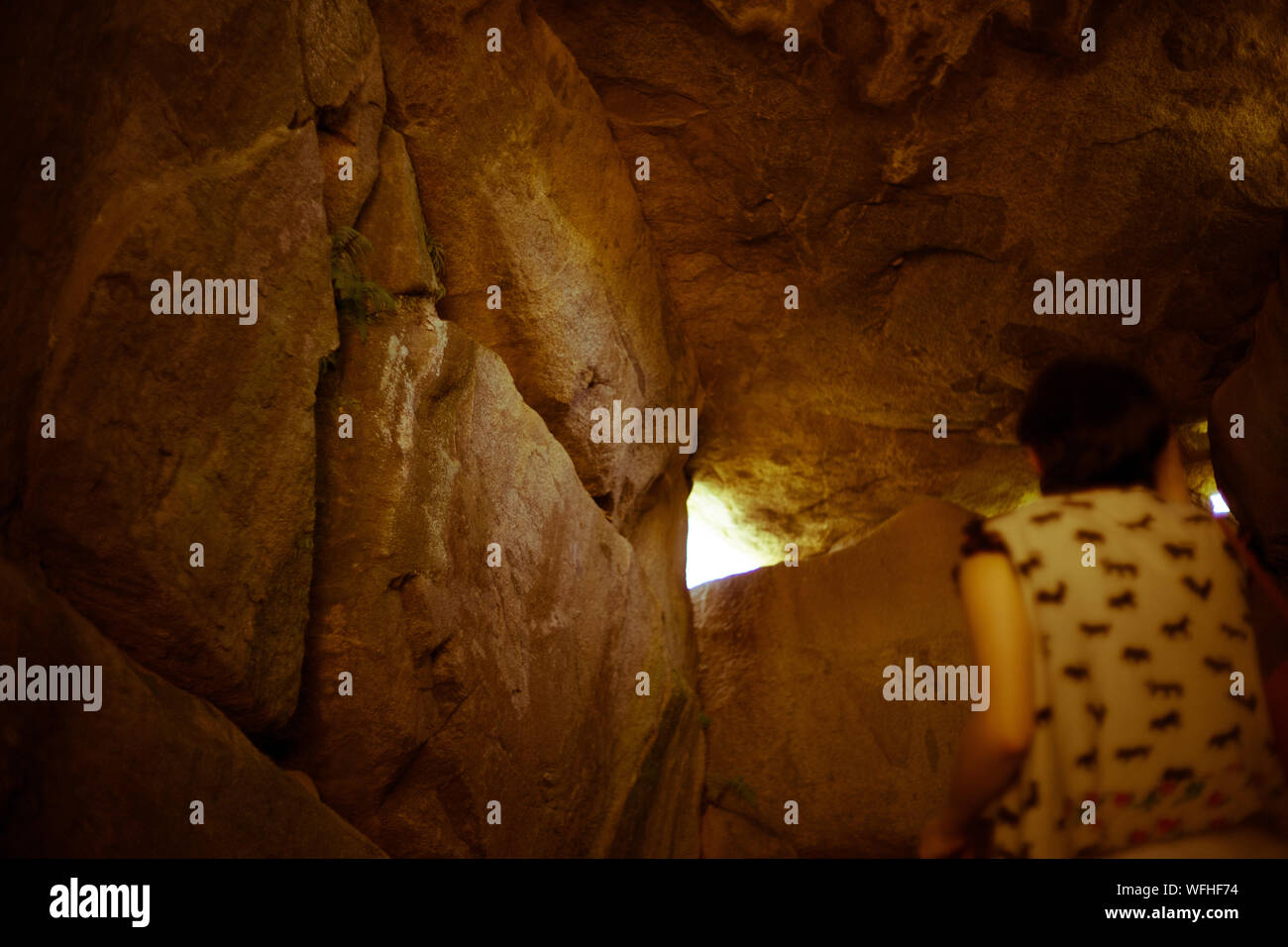 Woman walking in cave hi-res stock photography and images - Alamy
