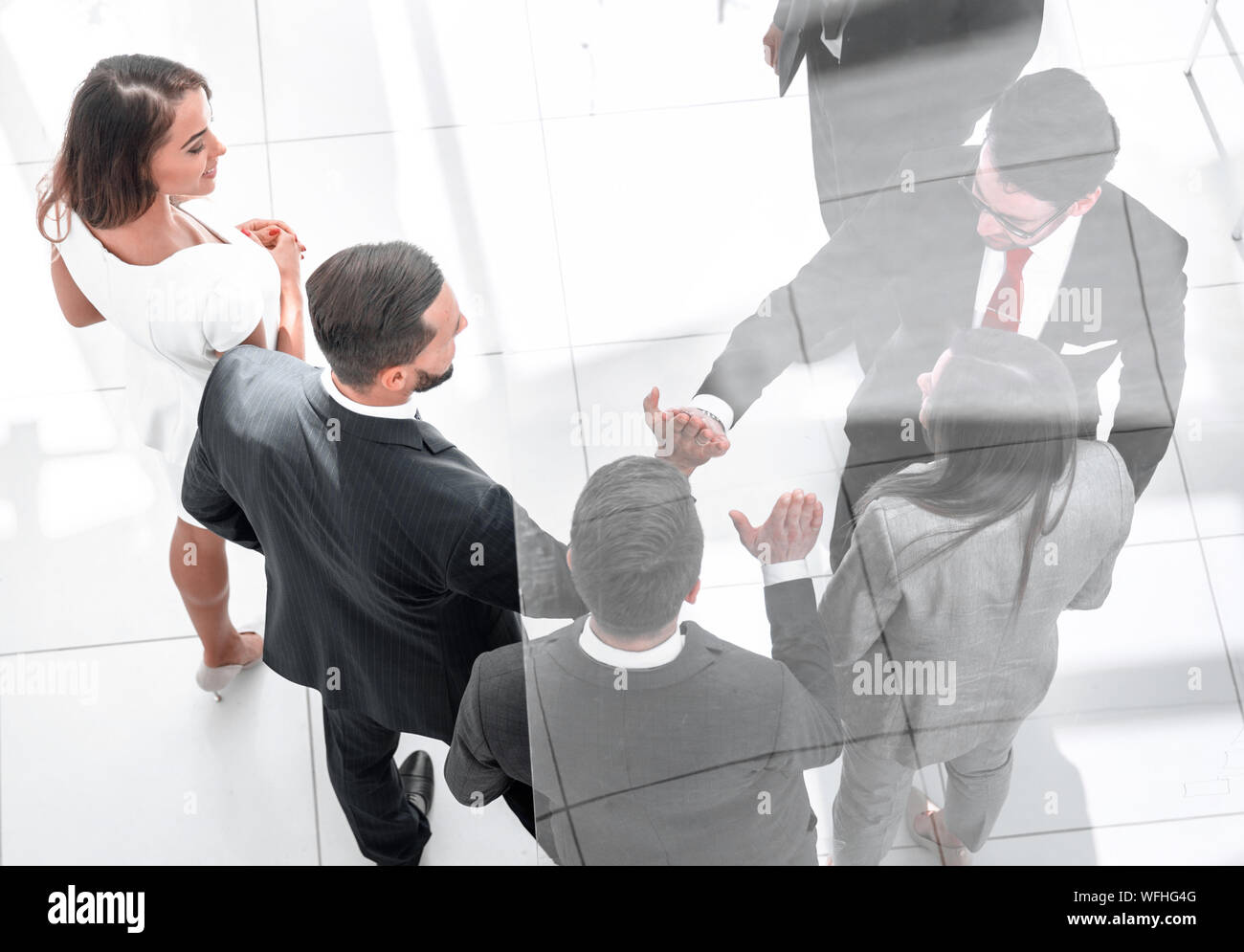 top view. business partners stretching out their hands for a handshake ...