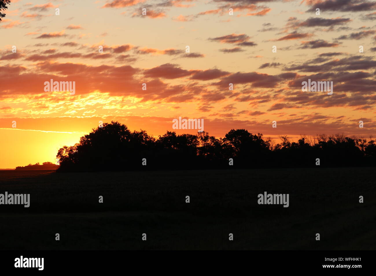 Sky on fire sunrise Stock Photo - Alamy