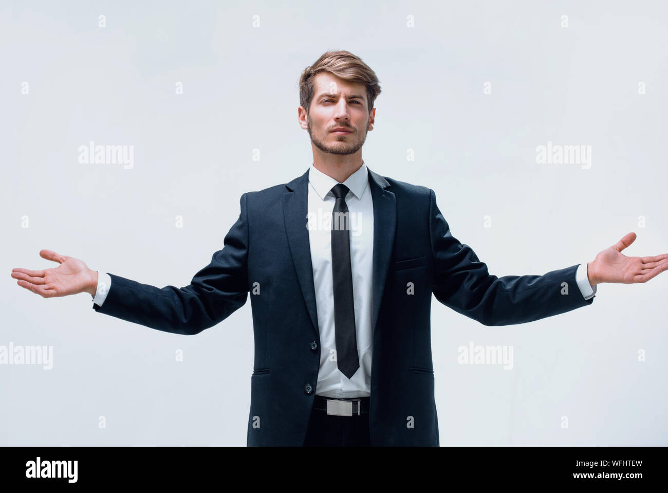 the man stands and spreads his hands Stock Photo - Alamy