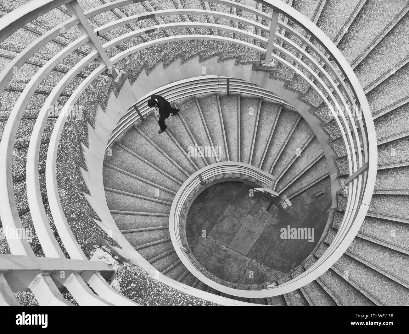 Walking up spiral staircase hi-res stock photography and images - Alamy
