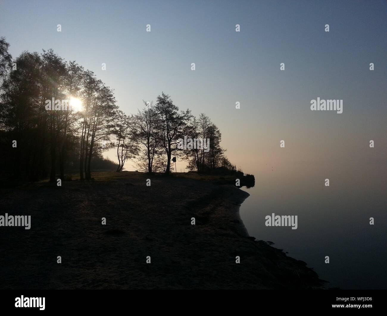 Sun shining through rock formation hi-res stock photography and images ...