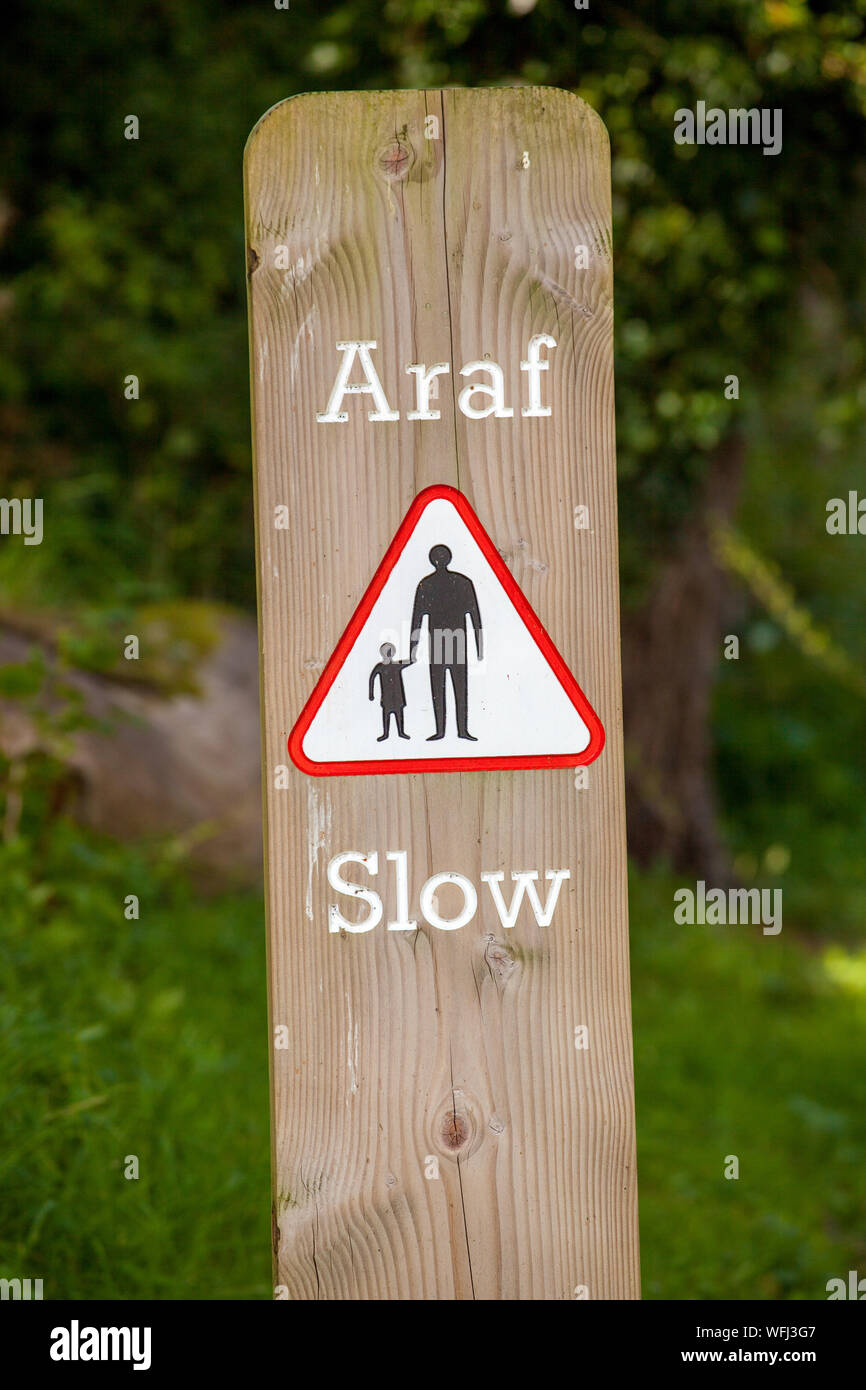 Sign post in Welsh saying slow Araf Stock Photo - Alamy