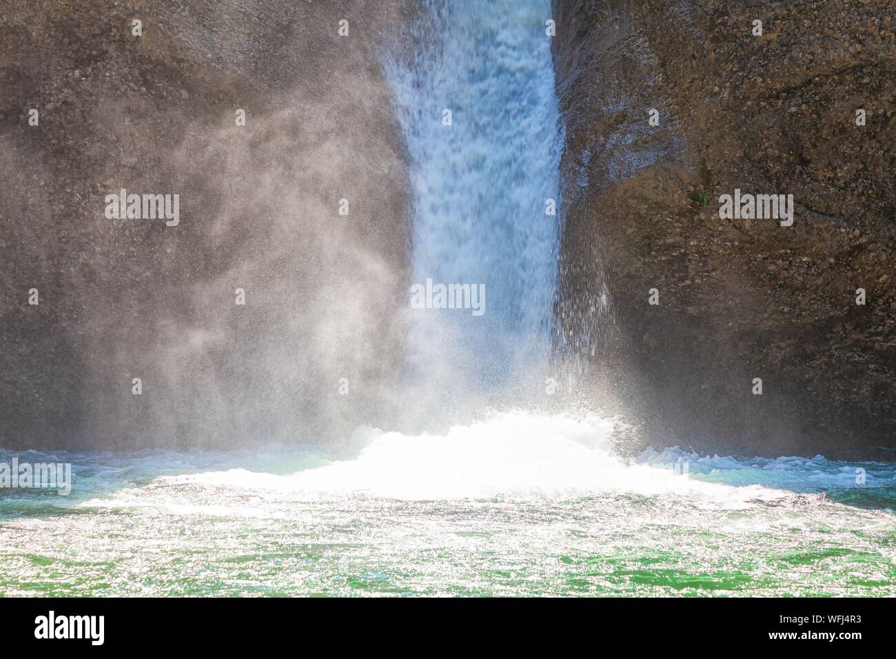 Waterfall and natural pool of water in the alps Stock Photo - Alamy
