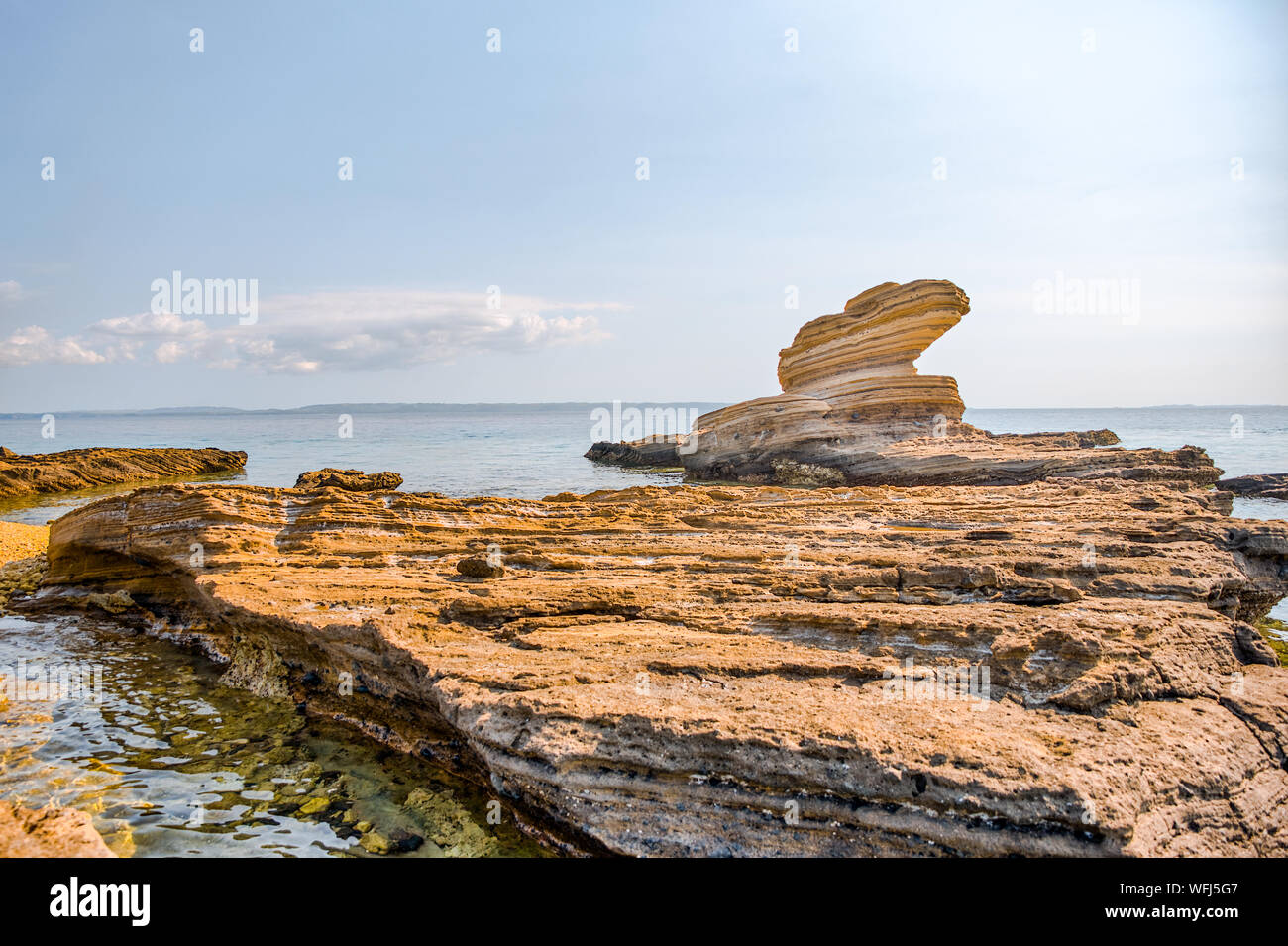 Wavy lines of rock formation of Animasola Island at Masbate ...