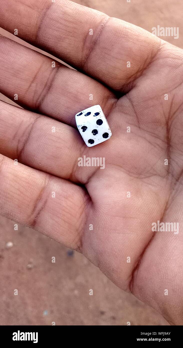 Man holding one dice hi-res stock photography and images - Alamy