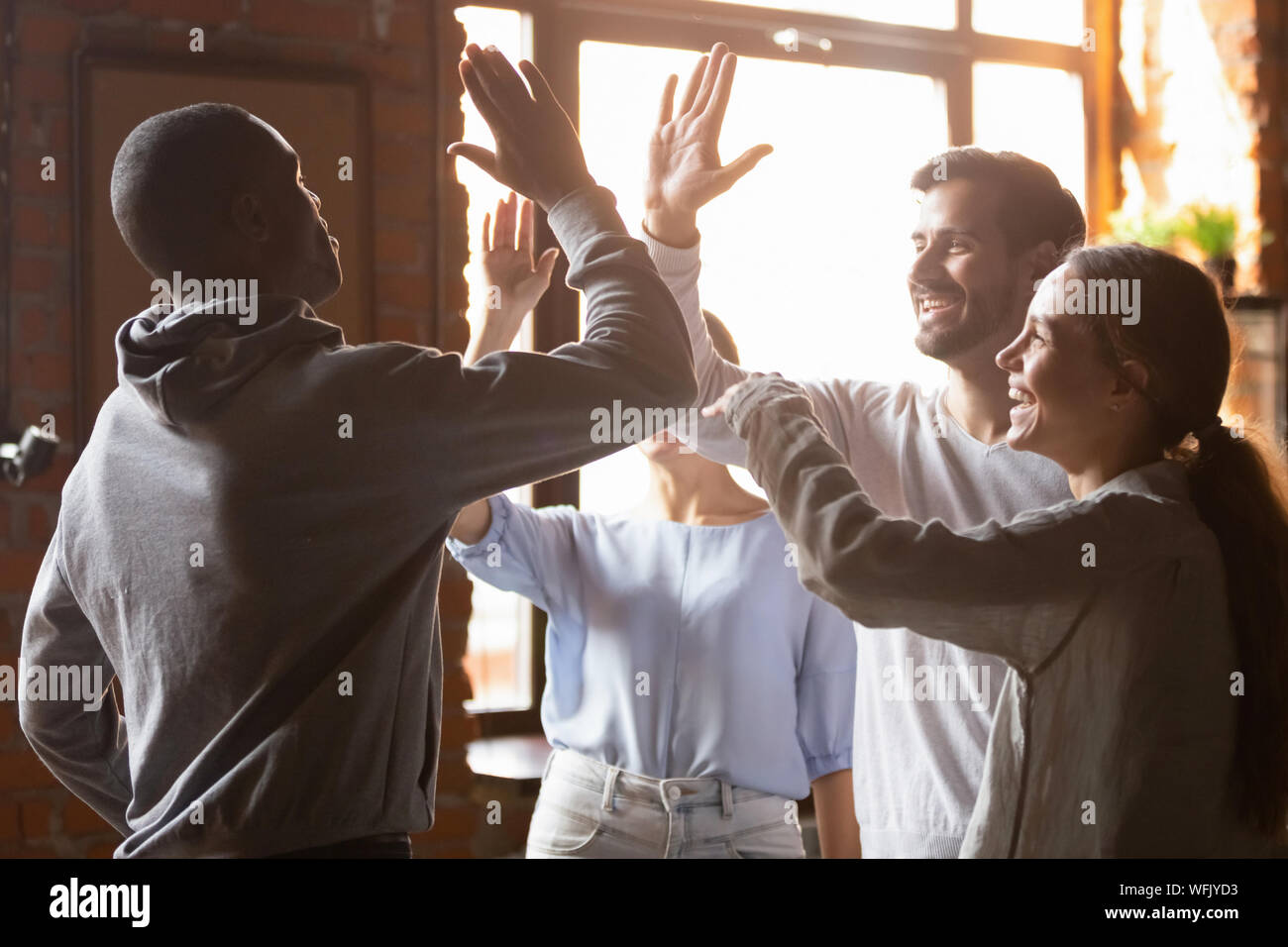 Community cafe high five hi-res stock photography and images - Alamy