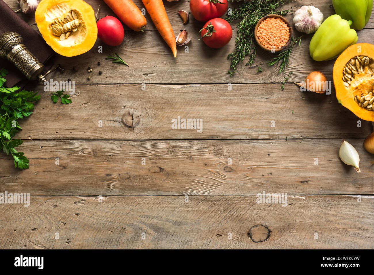 Autumn cooking background with seasonal organic vegetables on wooden ...
