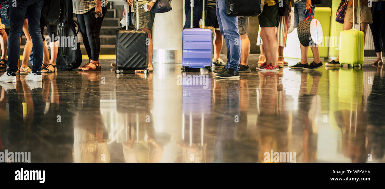 group of people waiting at their flight at the airport - travel concept ...