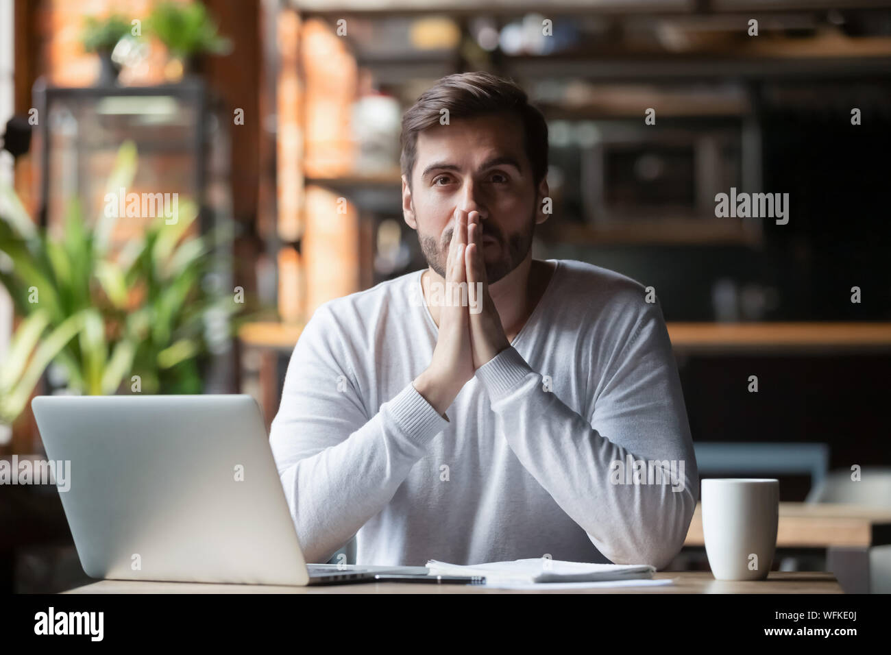 Thoughtful doubtful businessman in tension thinking make difficult ...