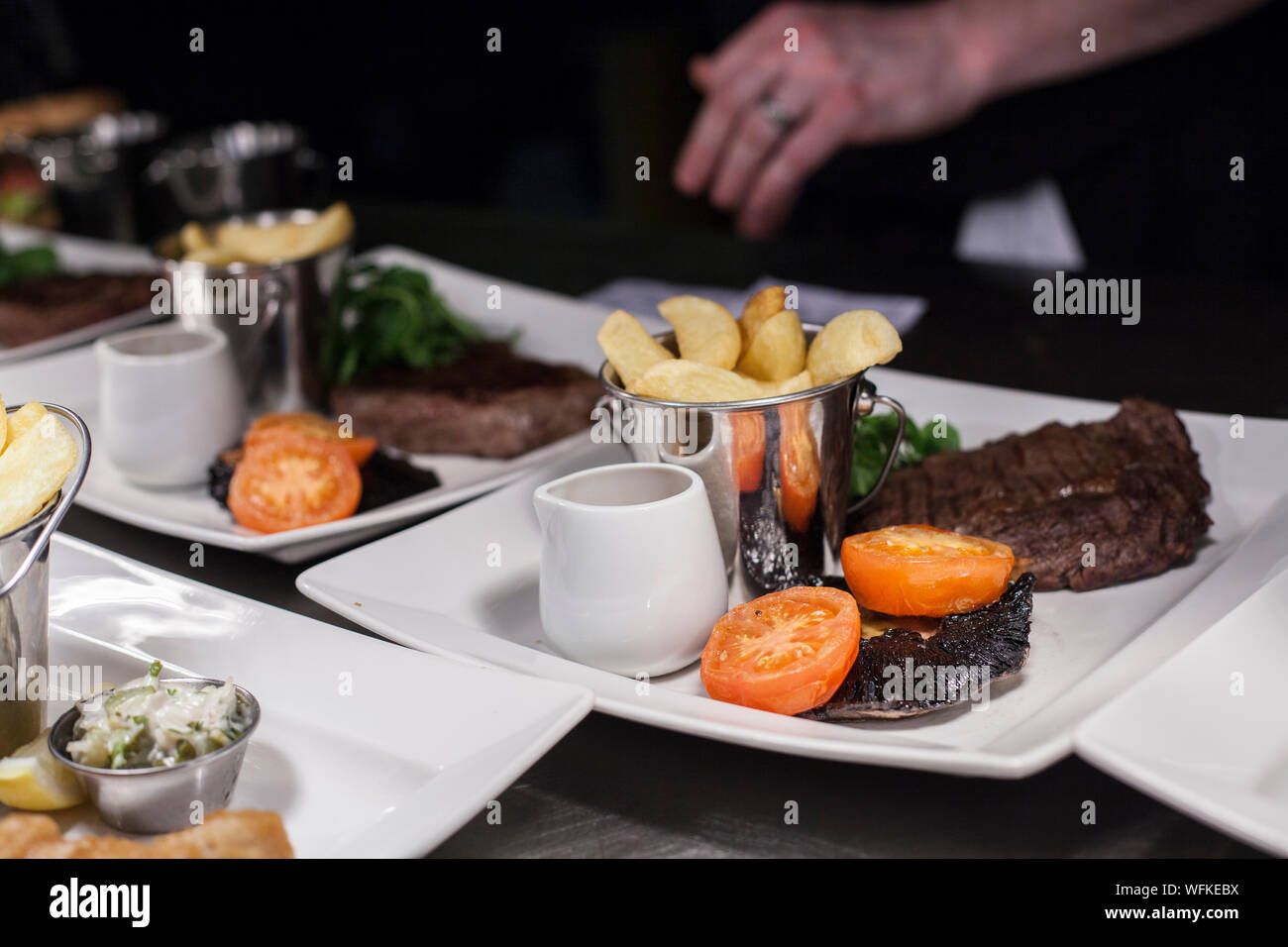 Food, plated, in a restaurant kitchen setting, but with no people ...