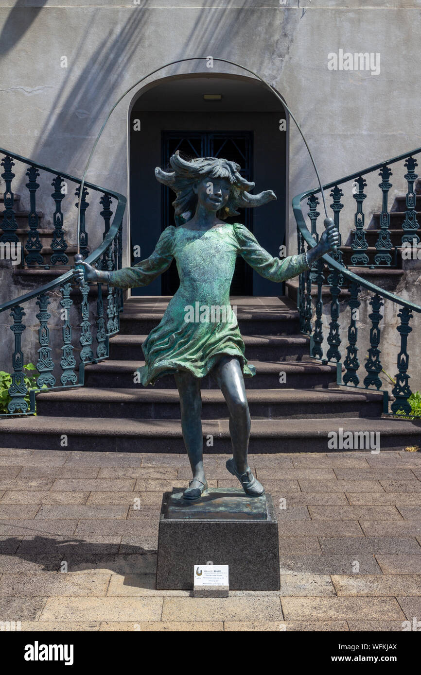 FUNCHAL, PORTUGAL - JULY 11, 2017: Statue of happy, smiling girl ...