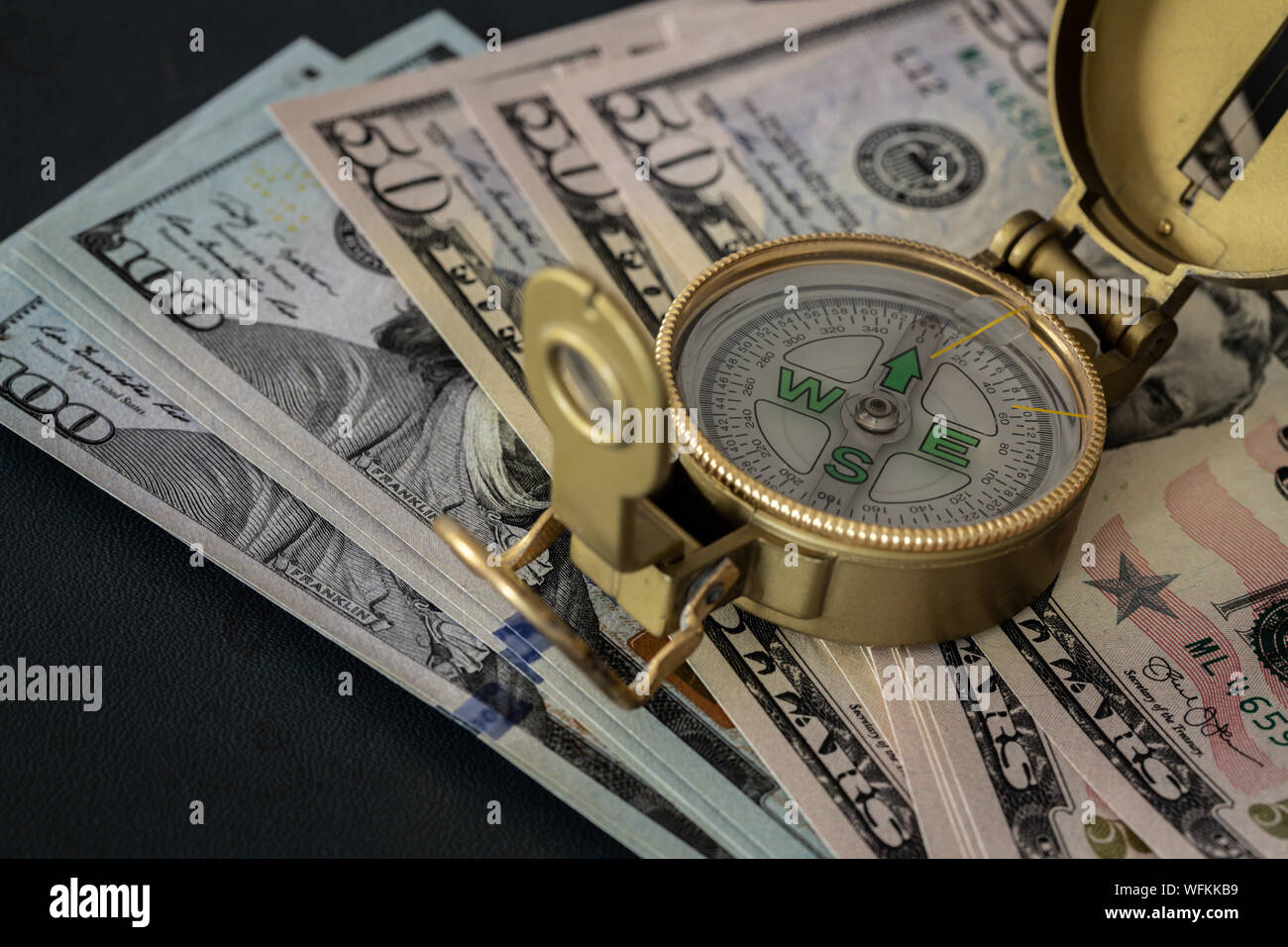 US dollars and compass / concept Stock Photo - Alamy
