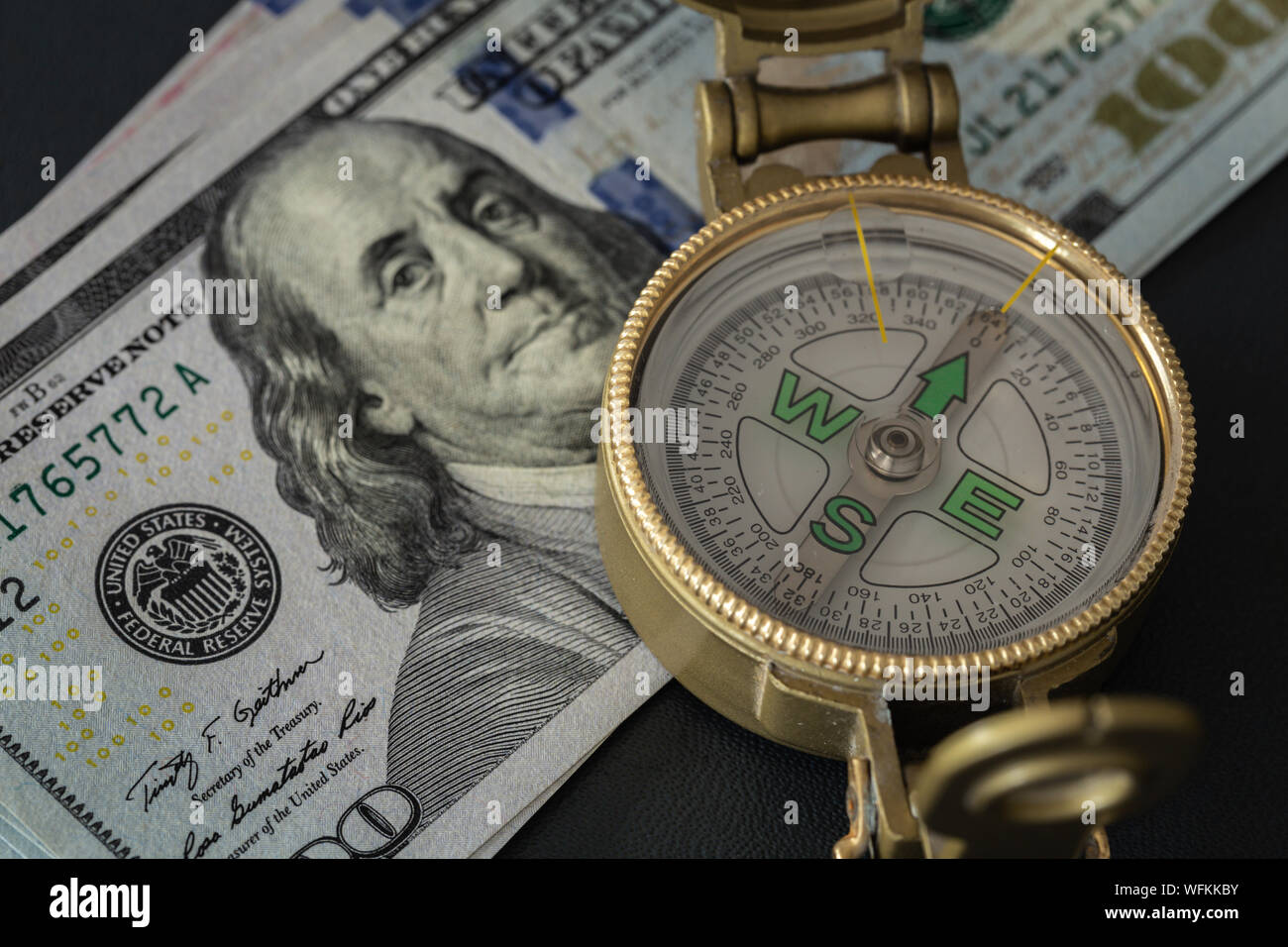 Compass money hi-res stock photography and images - Alamy