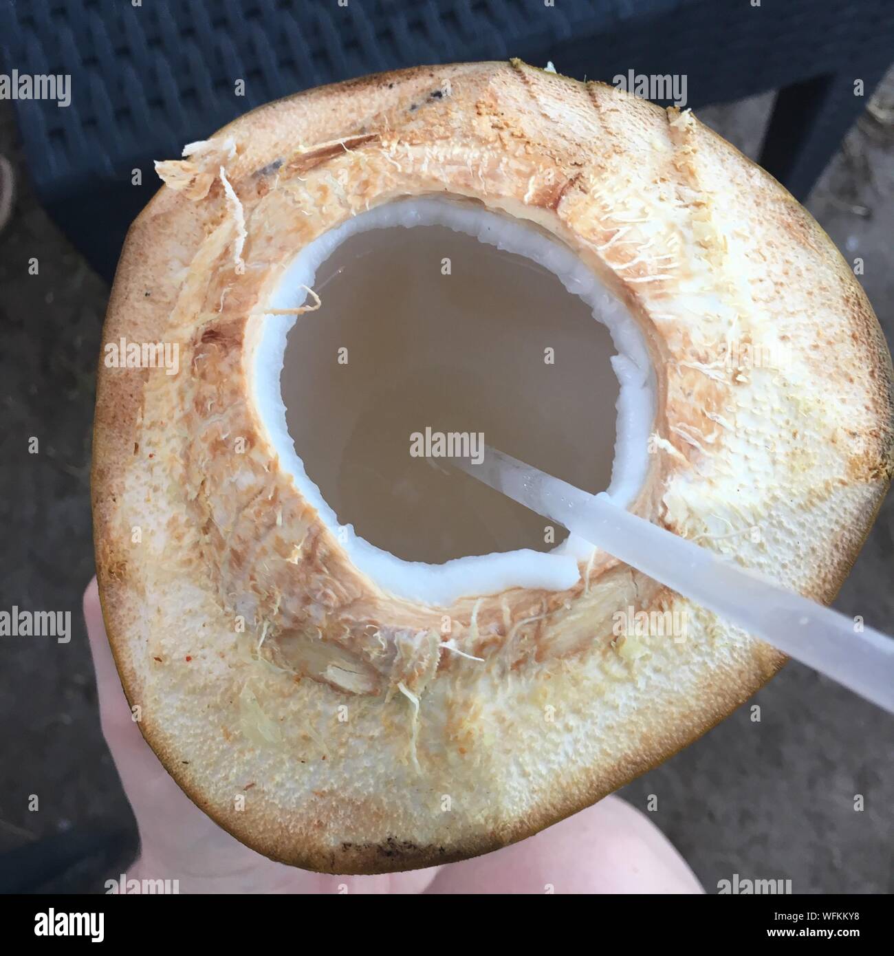 Hand holding coconut hi-res stock photography and images - Alamy