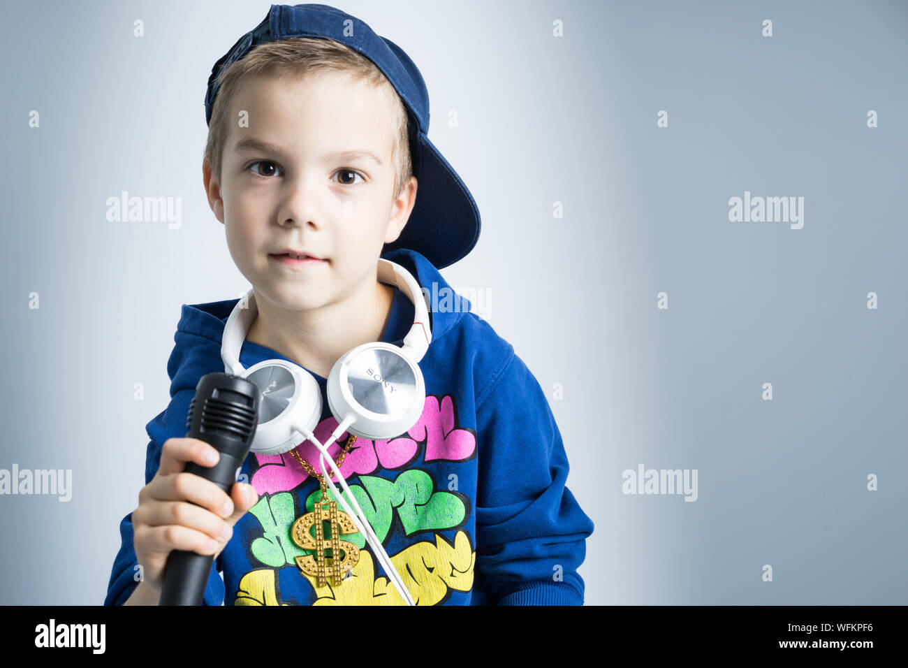 Boy Holding Microphone High Resolution Stock Photography and Images - Alamy