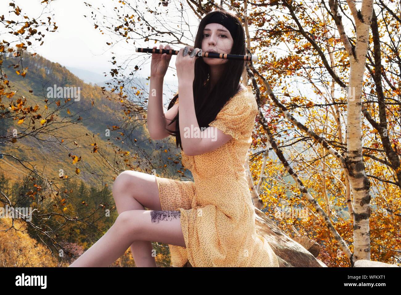 Young woman playing flute hi-res stock photography and images - Alamy