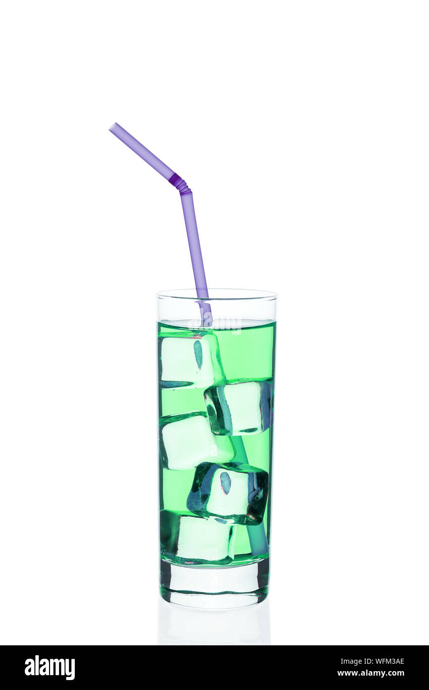 Green drink with ice cubes in a glass on a white background. Chilled ...