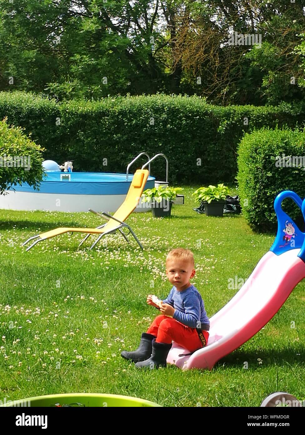 Water slide boy hi-res stock photography and images - Alamy