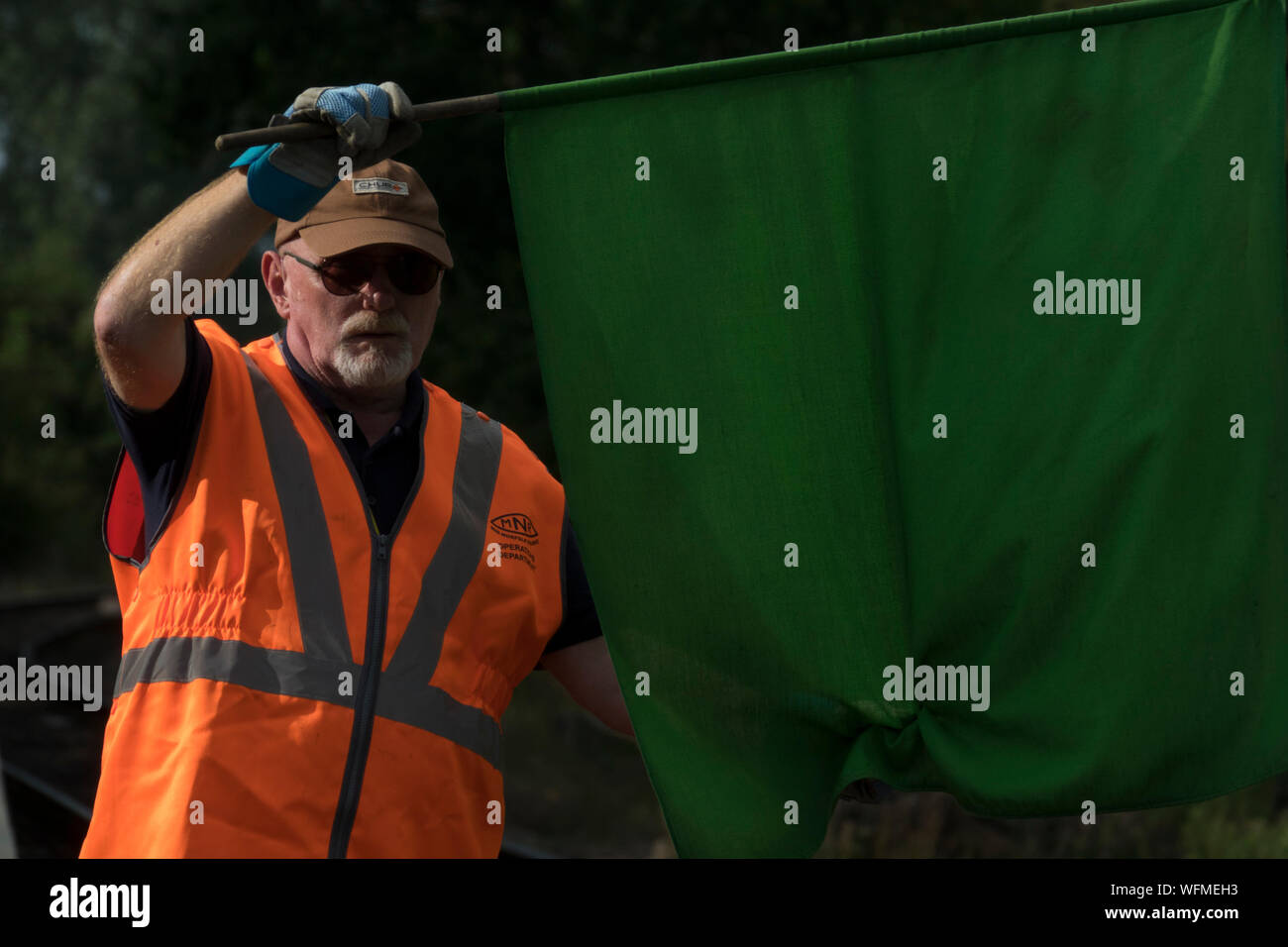 Man green flag hi-res stock photography and images - Alamy