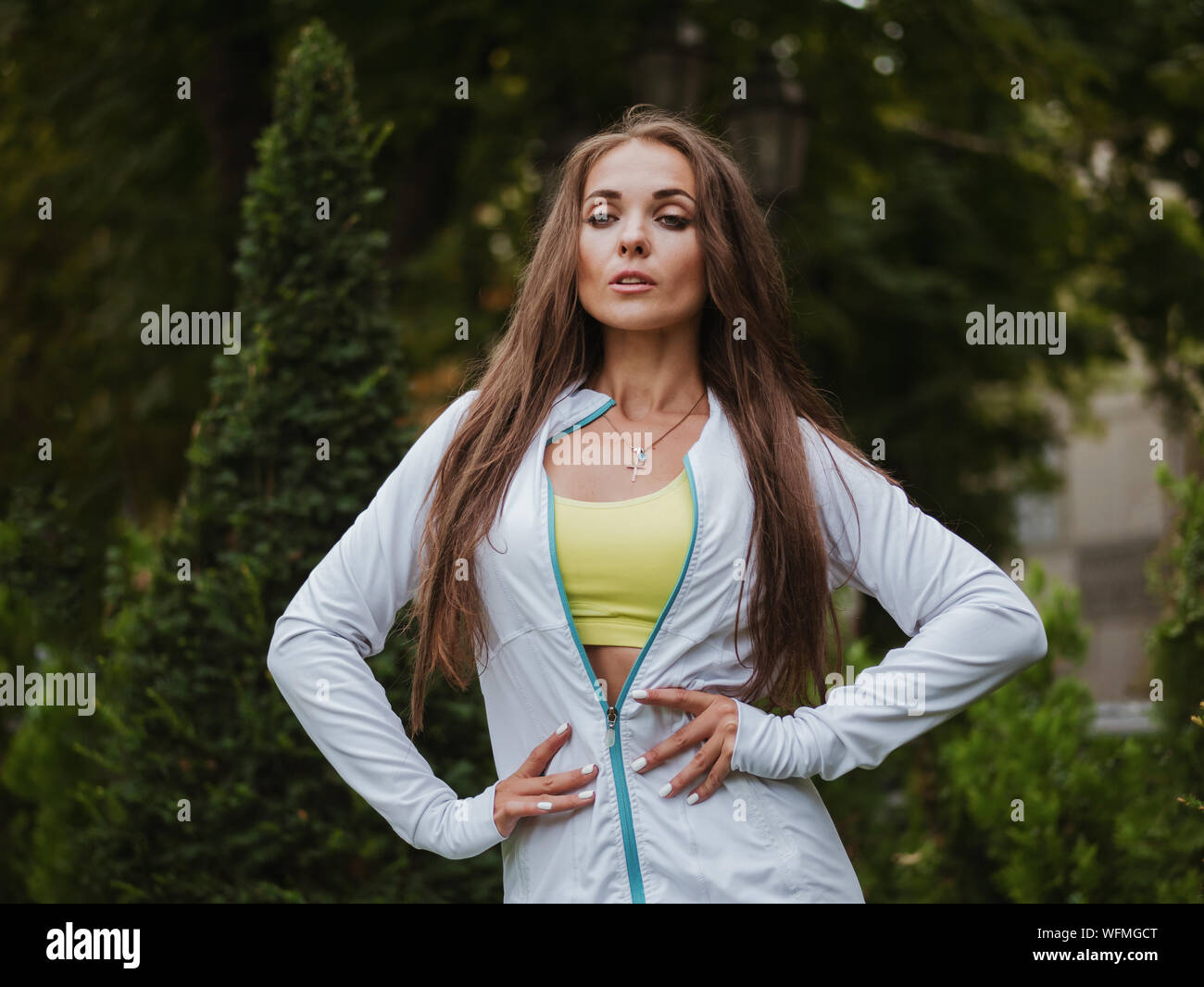 Woman standing akimbo hi-res stock photography and images - Alamy