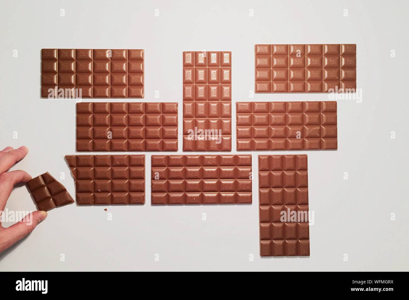 Hand chocolate bar hi-res stock photography and images - Alamy