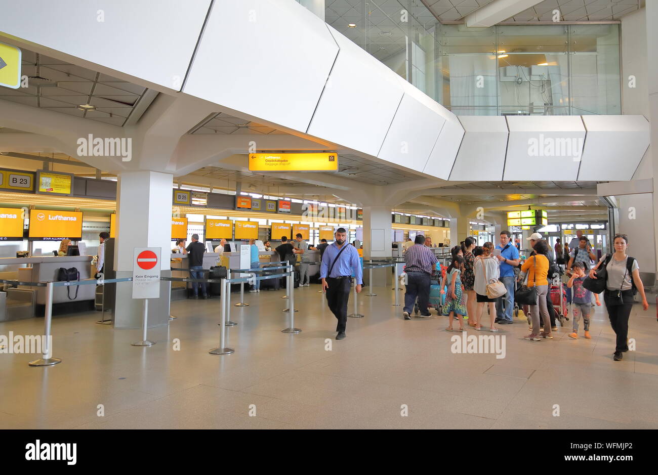 People Check In At Lufthansa Counter Tegel Airport Berlin Germany Stock