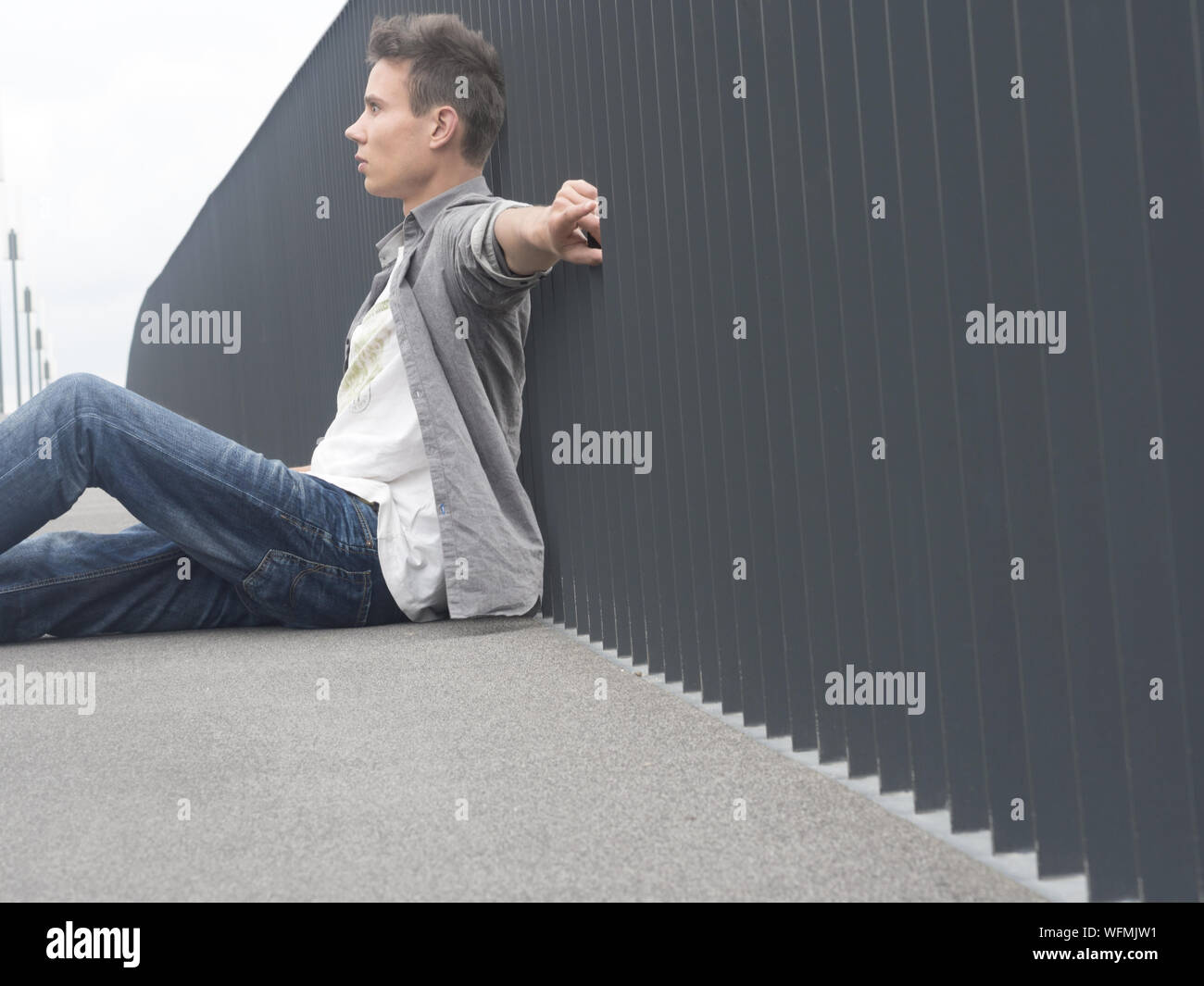 Man sitting side view hi-res stock photography and images - Alamy
