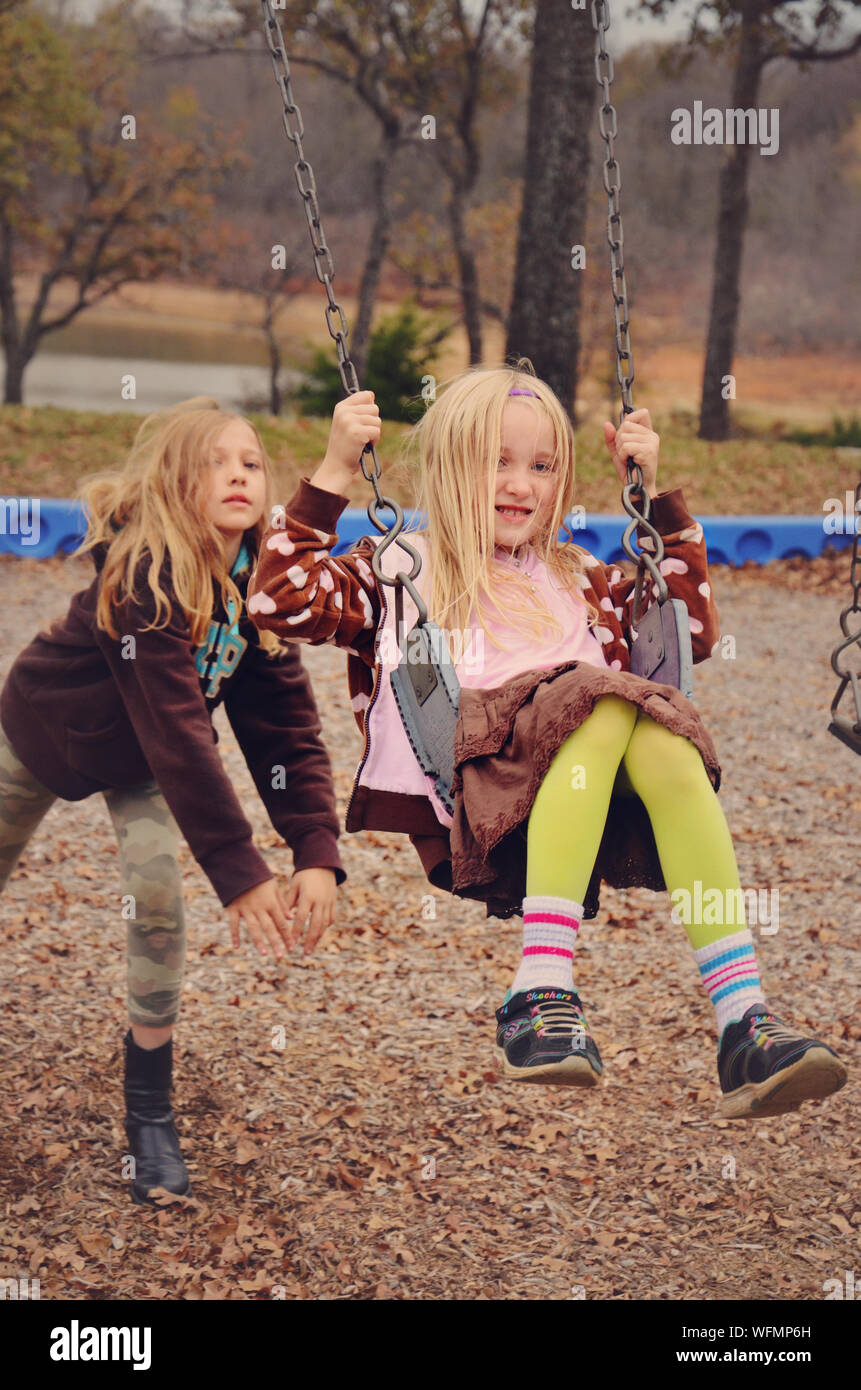 Two girls playing in the park hi-res stock photography and images - Alamy
