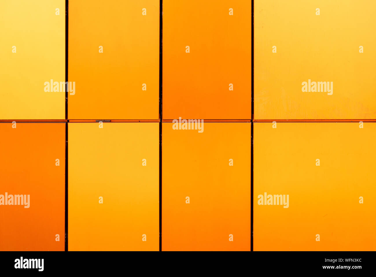 Bright yellow and orange and multicolored tile of different size for ...