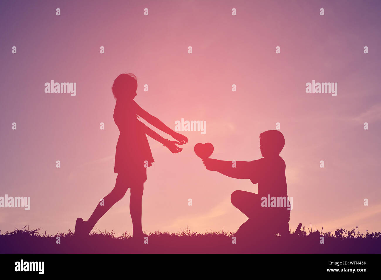 Boy girl holding heart hi-res stock photography and images - Alamy