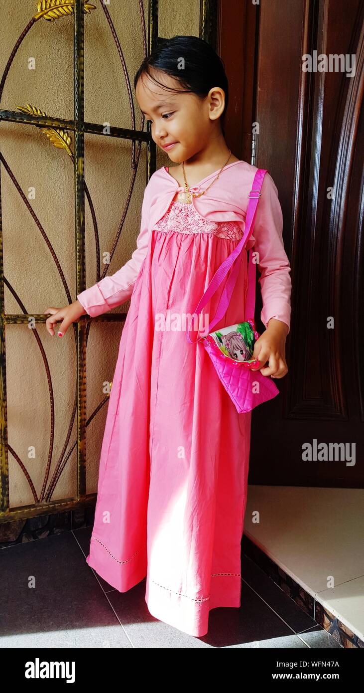 Girl wearing pink dress hi-res stock photography and images - Alamy