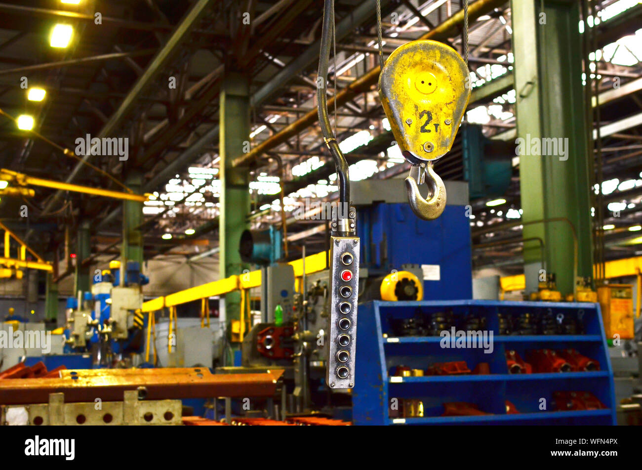 Crane hook of the overhead crane in the workshop of an industrial plant ...