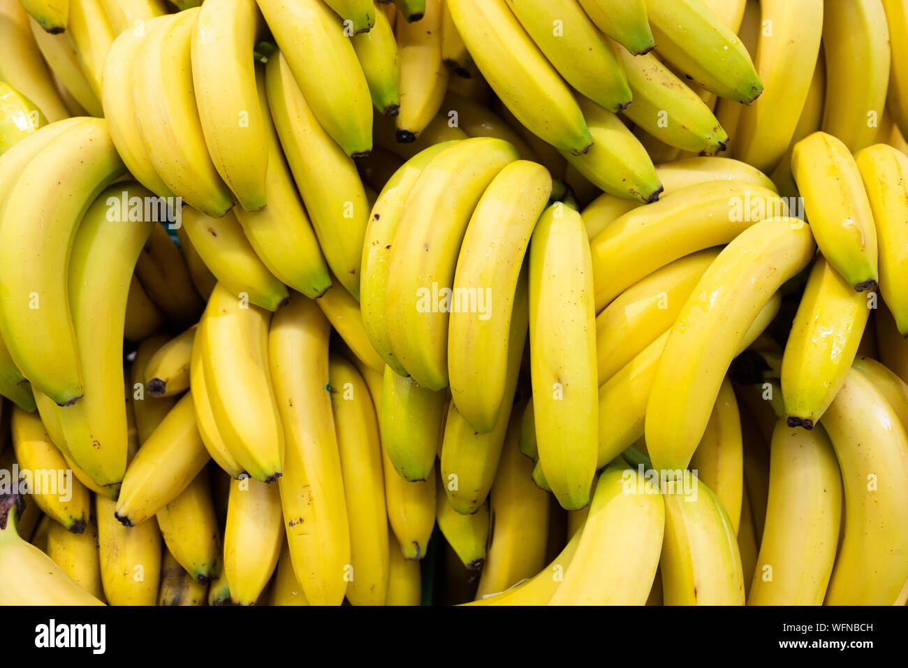 Whole bundle of ready-to-eat bananas for food background Stock Photo ...