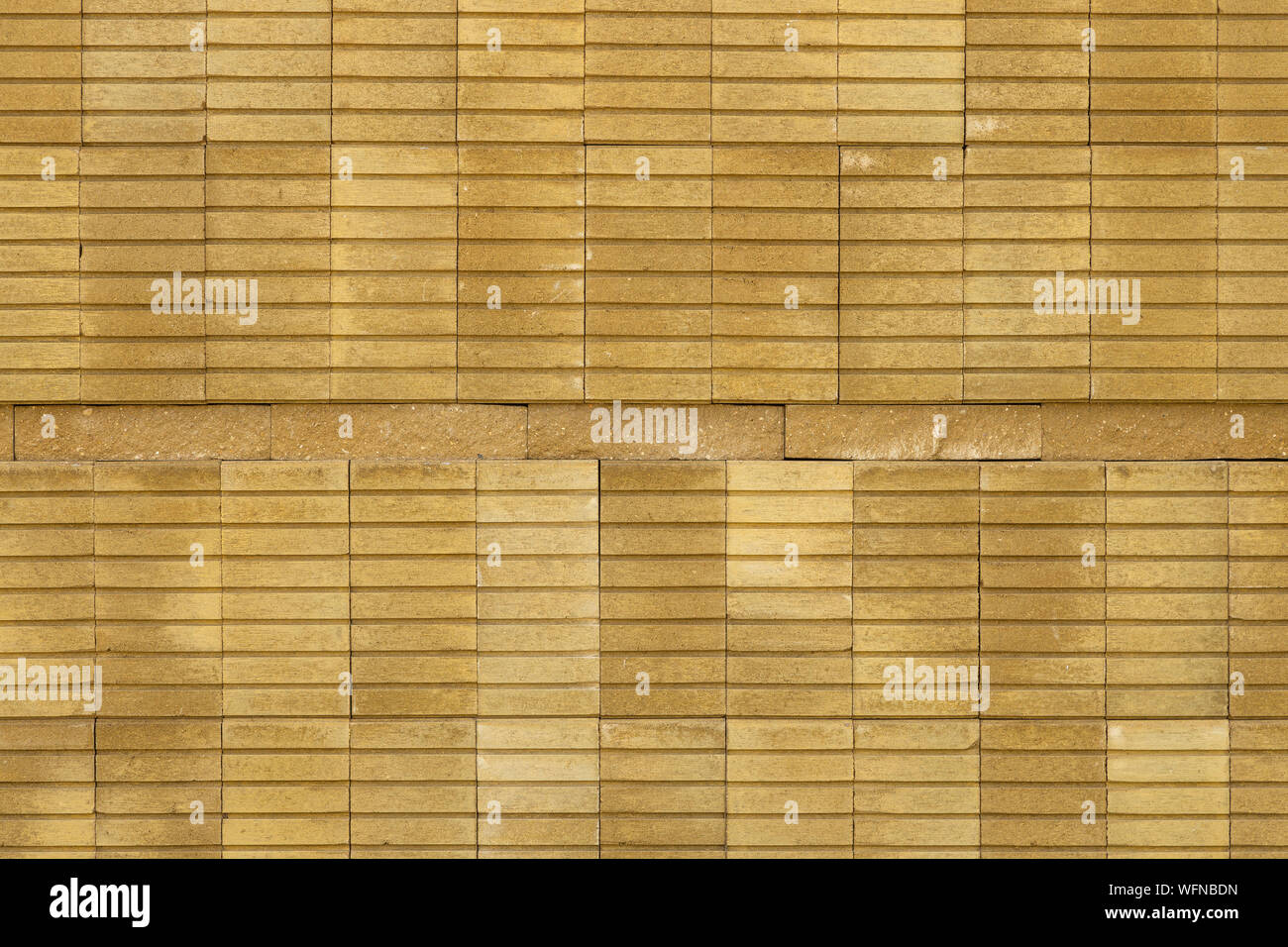 Front view of red brick wall. Tile on wall. Building exterior wall ...