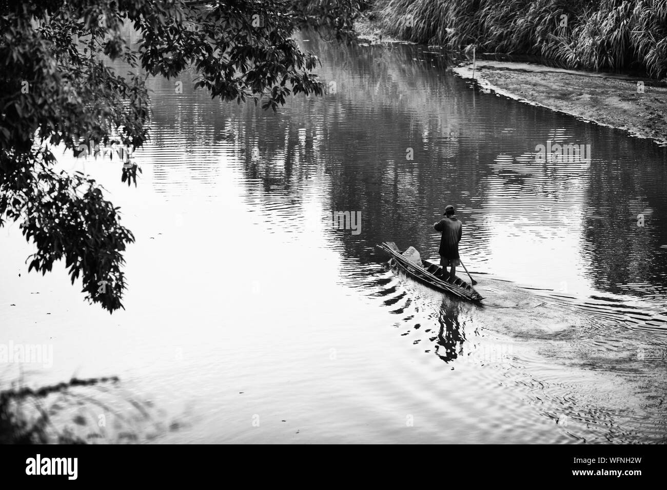Men in rowing boat Black and White Stock Photos & Images - Alamy