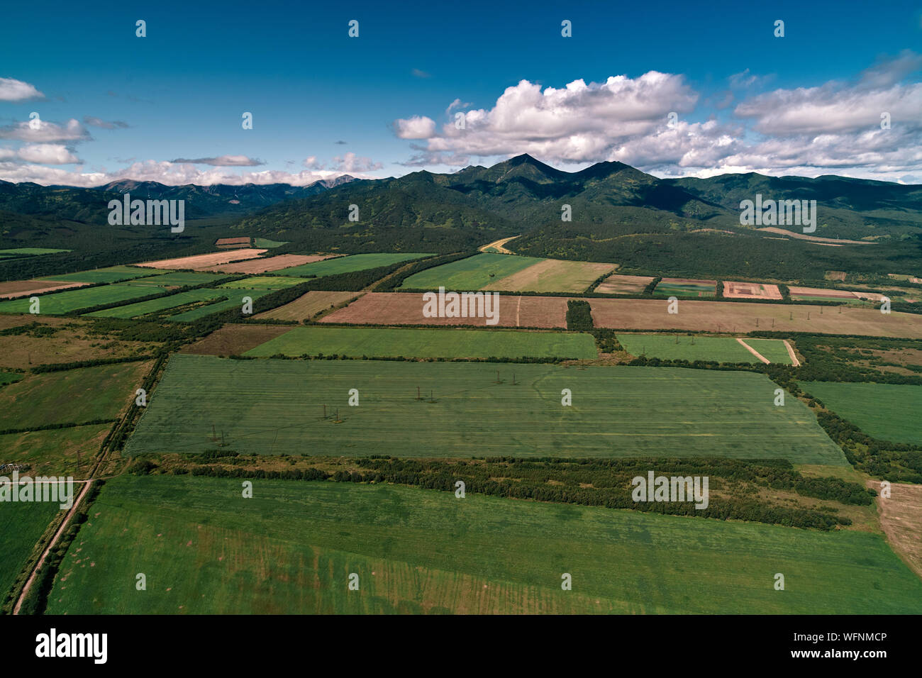 Aerial view of farm fields valley in the Kamchatka in Russia. Wide ...