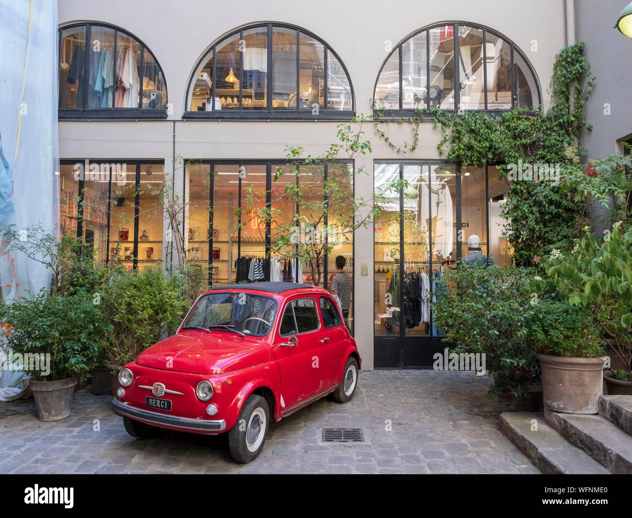 France, Paris, Fiat 500 parked in the Merci decoration store courtyard ...