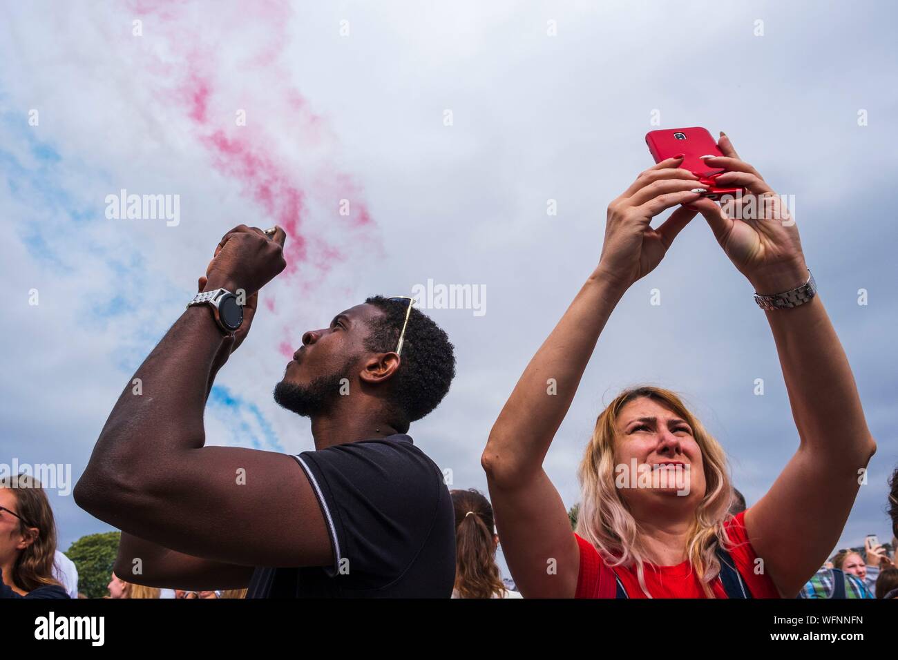 France, Paris, July 14th parade (Bastille Day), couple photographing ...