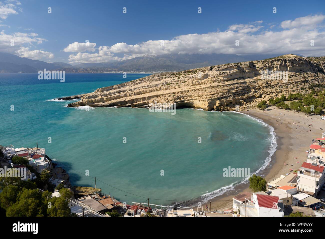Greece, Crete, Matala, Matala Bay, beach and caves seen from the south ...