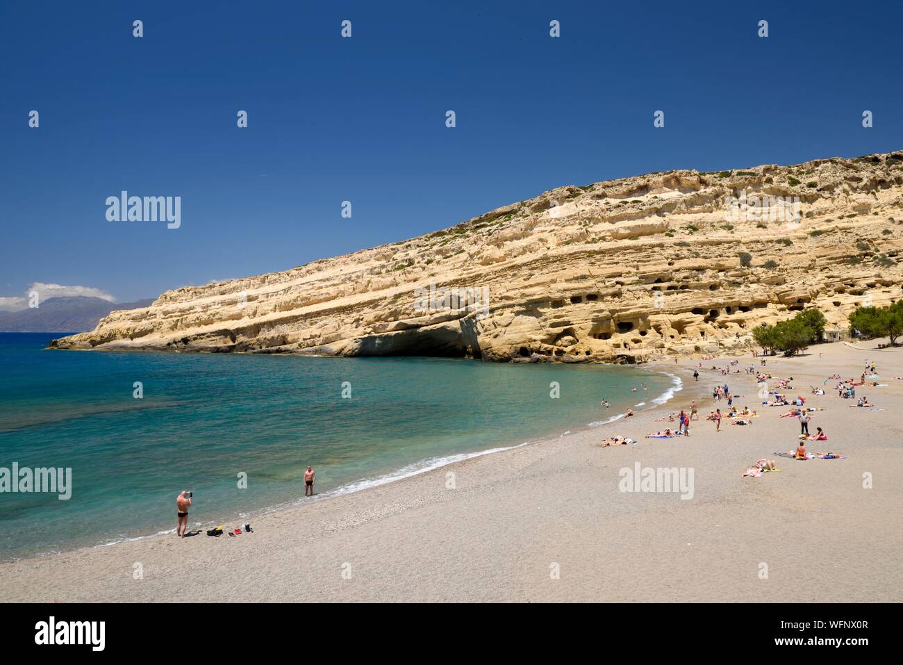 Greece, Crete, Matala, Matala Bay, beach and caves Stock Photo - Alamy